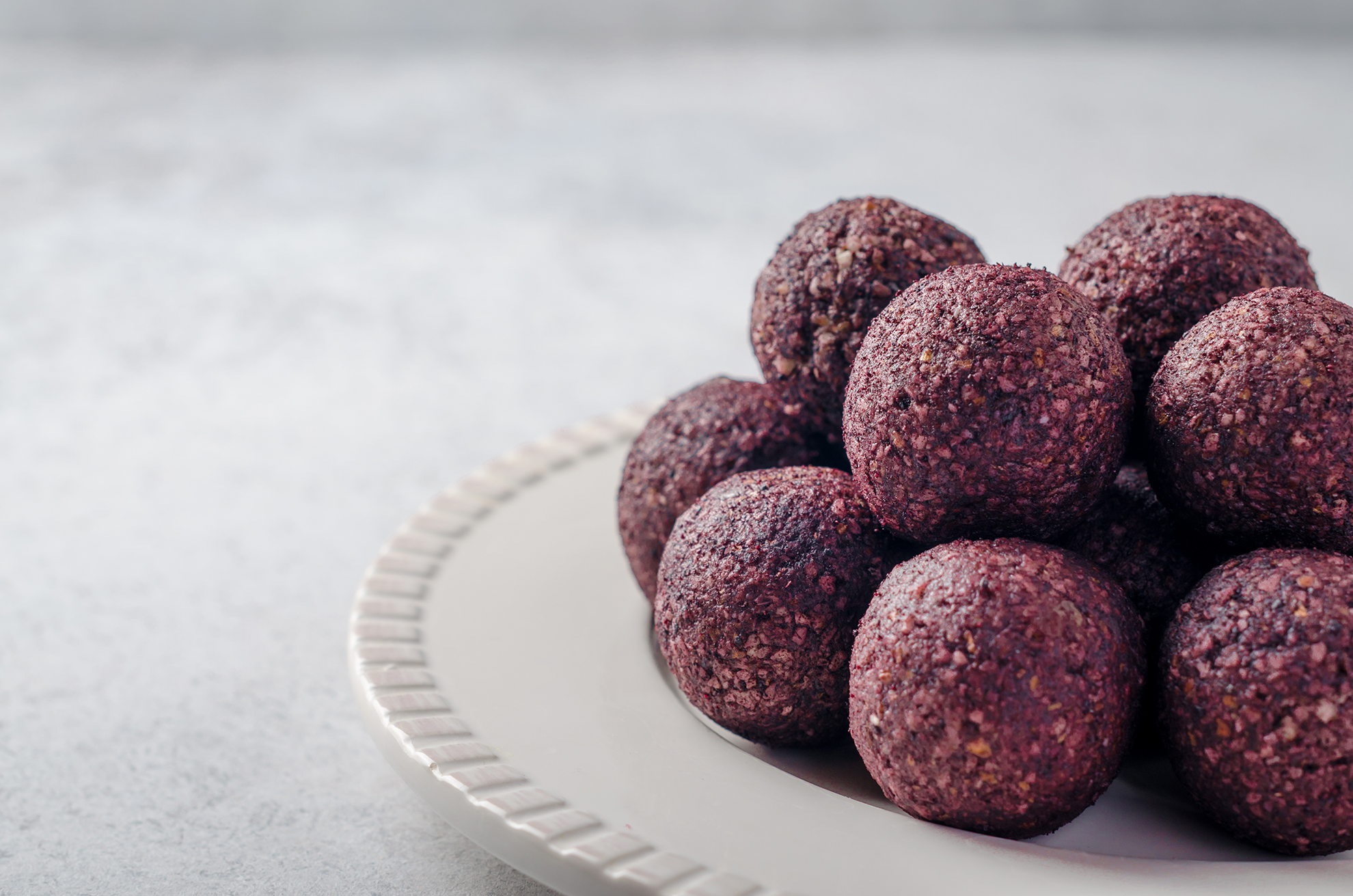 Raspberry Coconut Cashew Bliss Balls - Cook Nourish Heal